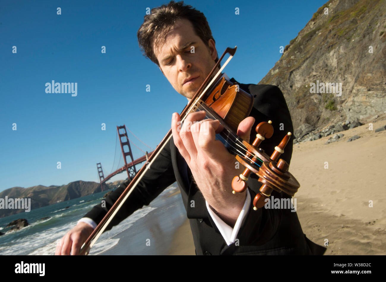 Handsome male violinist in black hi-res stock photography and images ...