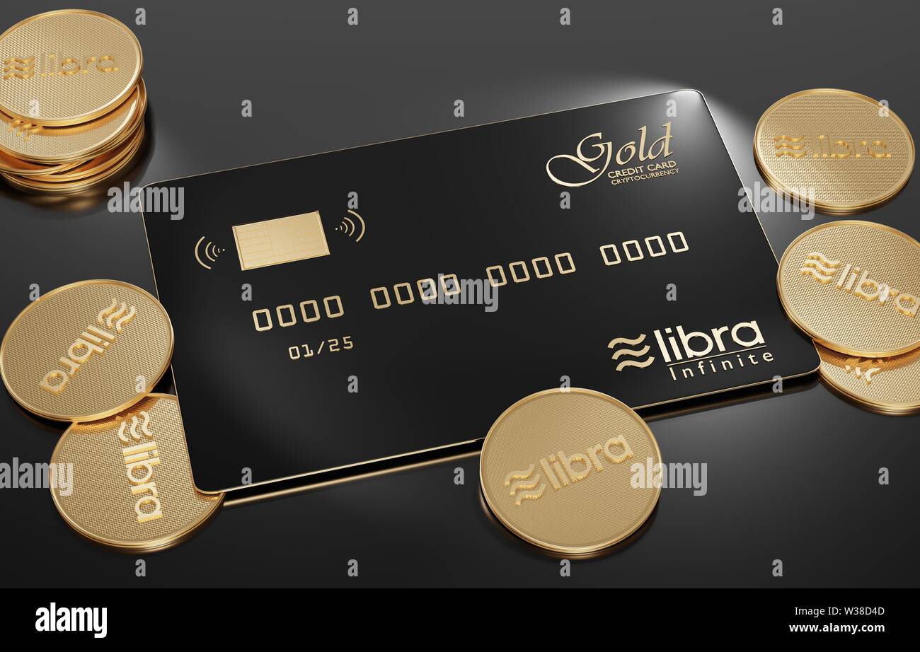 View of Libra black credit card GOLD and golden Libra coins lying on a ...