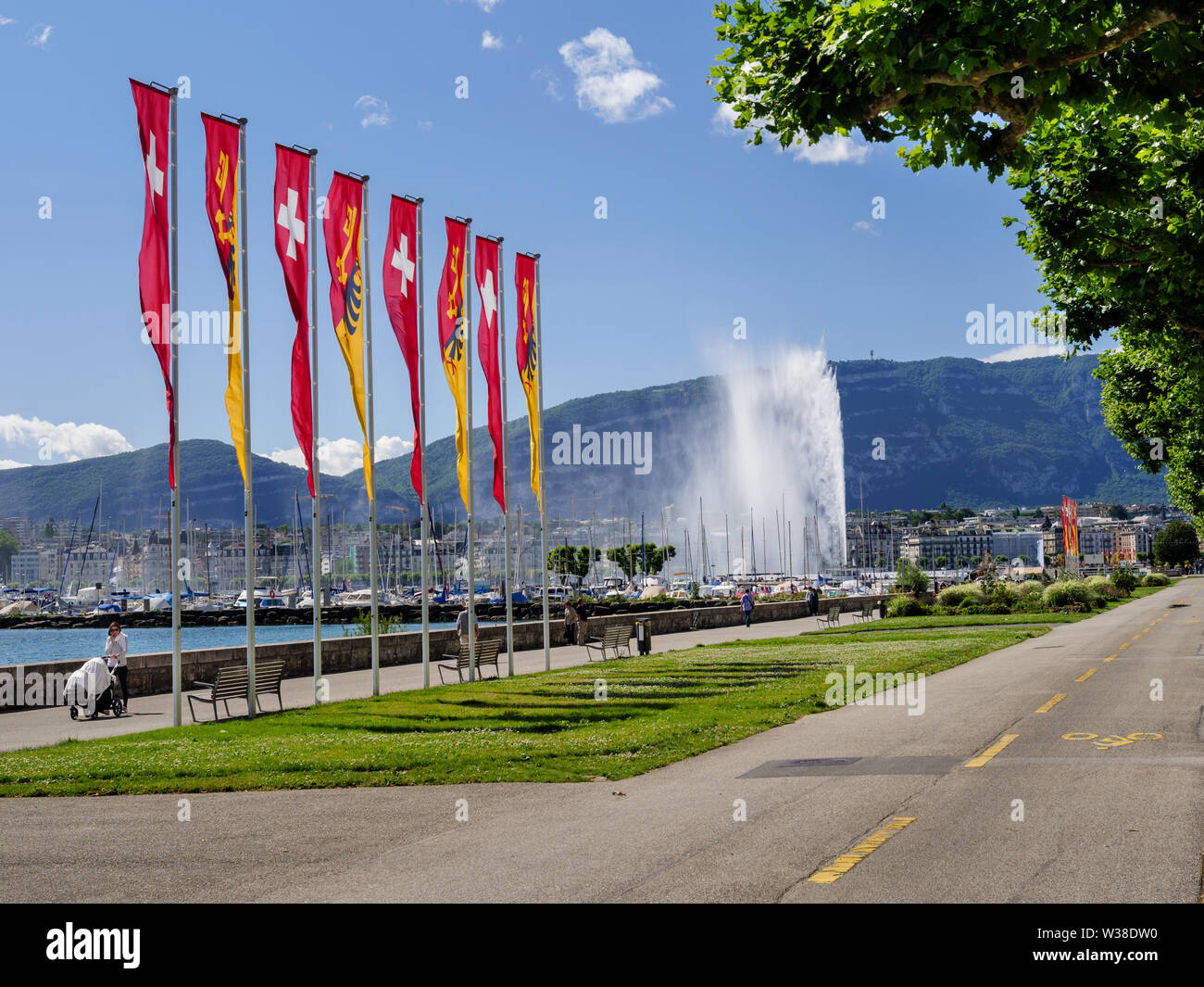 The Geneva flag and the Swiss flag floating in the wind at quay Wilson ...