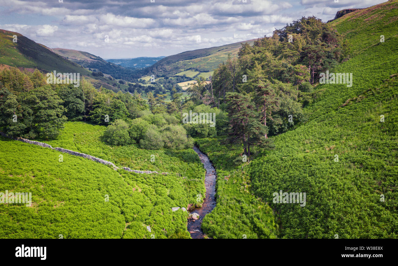 Afton Rhaeadr among fern covered hill ridge with scenic valley in ...