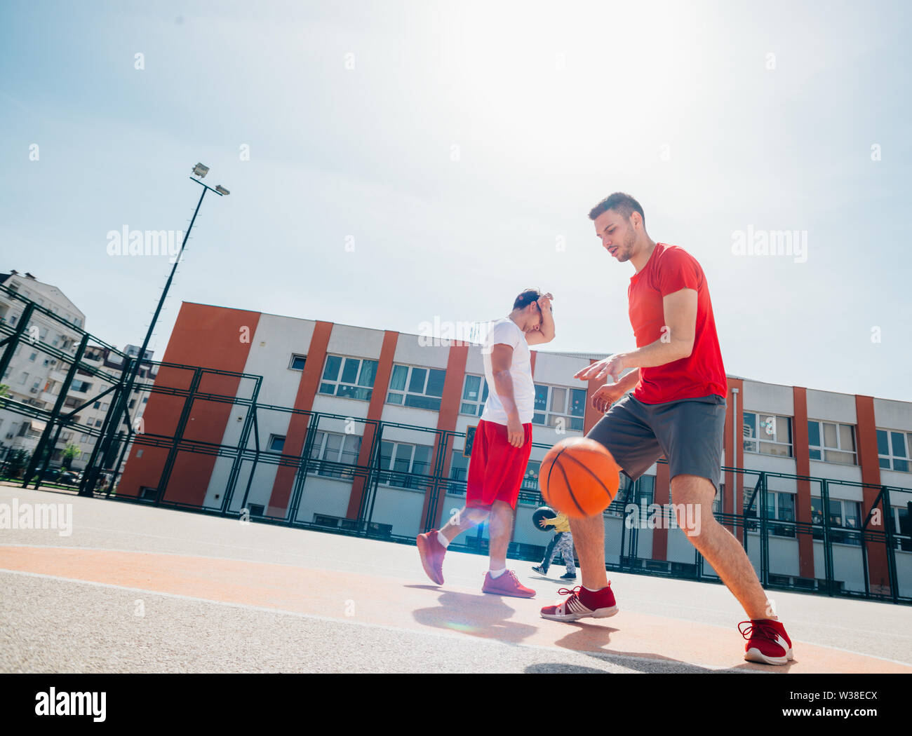 Two caucasian basketball player fighting for ball possession at the ...