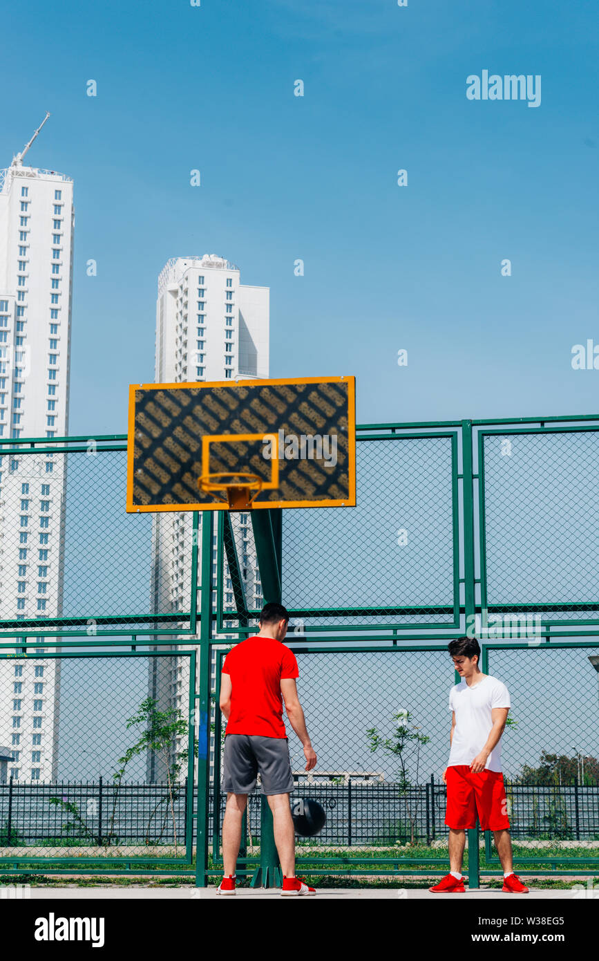 Basketball players playing ball(pushing, dribbling) on an urban ...