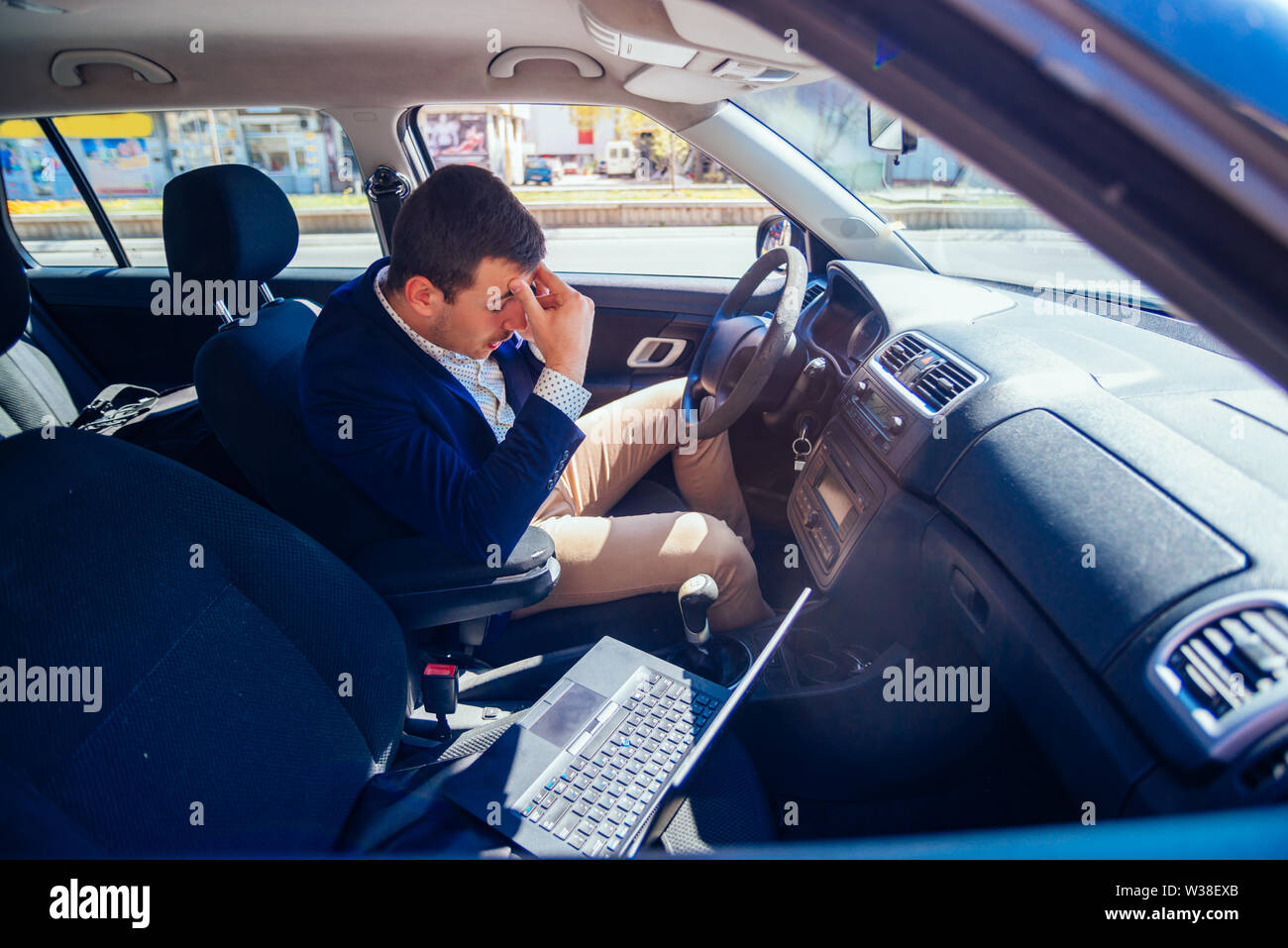 Reckless businessman driving in the city during the rush hour while ...