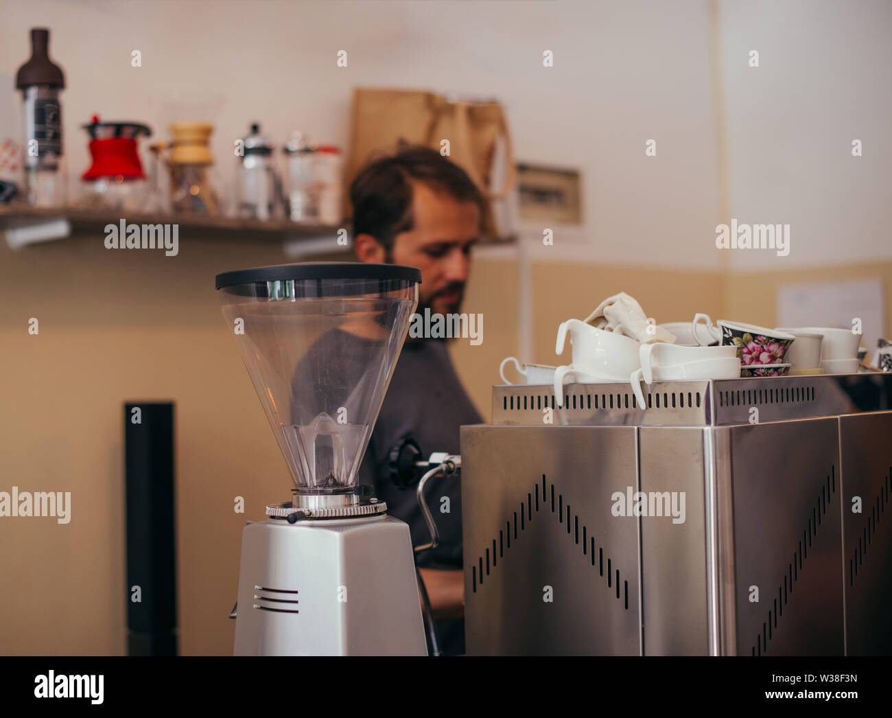 Professional expert barista makes coffee with a coffee machine Stock ...