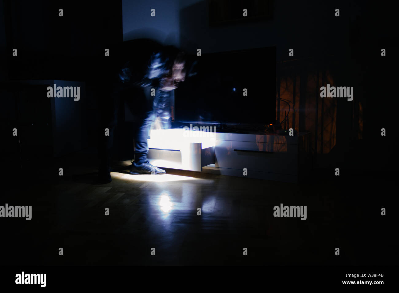 Burglary man breaking into a home at night and stealing Stock Photo - Alamy