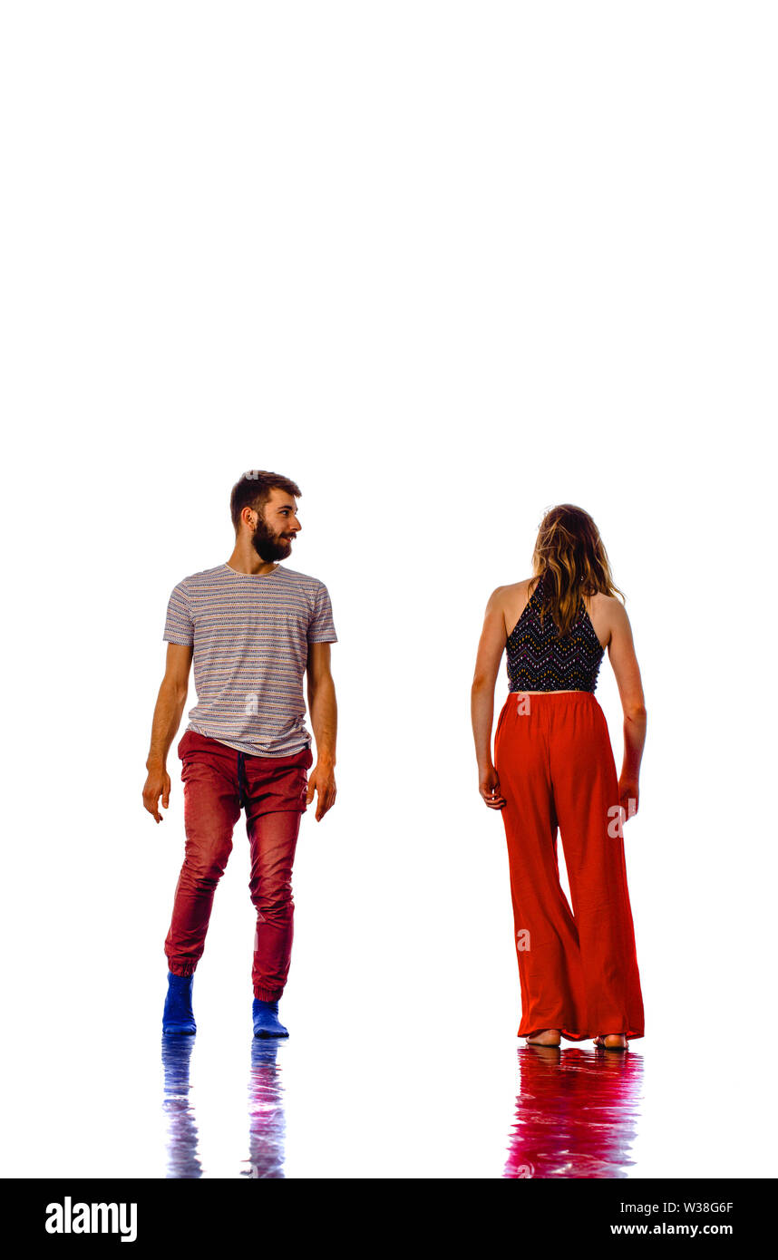 Romantic couple dancing and smiling in studio Stock Photo - Alamy