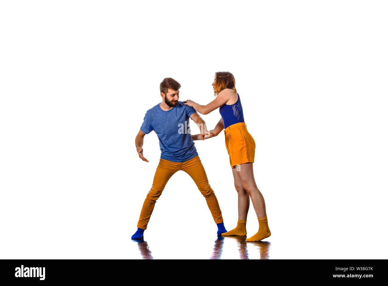 Guy and girl in dance movement. Modern style young dancers performing ...