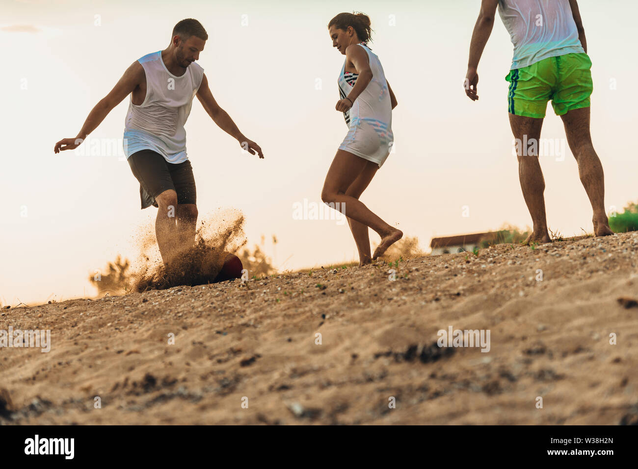 Woman kicking the sand hi-res stock photography and images - Alamy