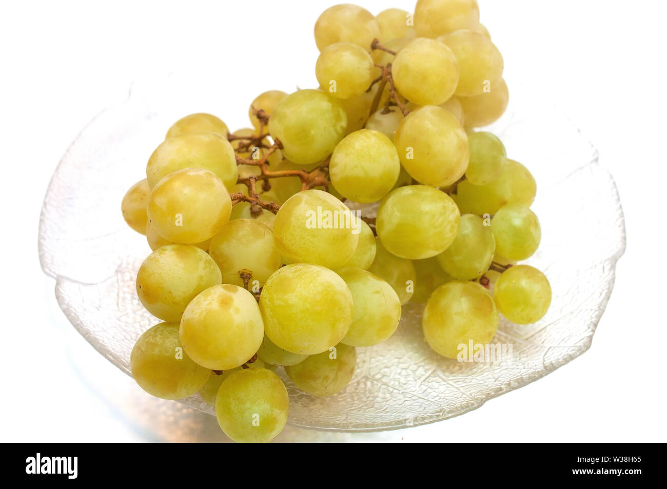Seedless grapes in a plate isolated on white Stock Photo - Alamy