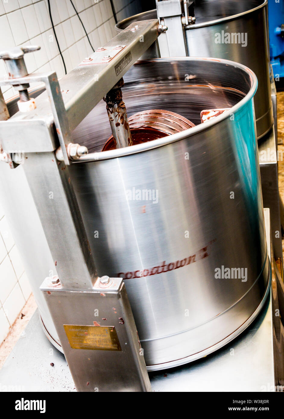 Chocolate Factory- milling machines. Inside look. Chocolate coated ...