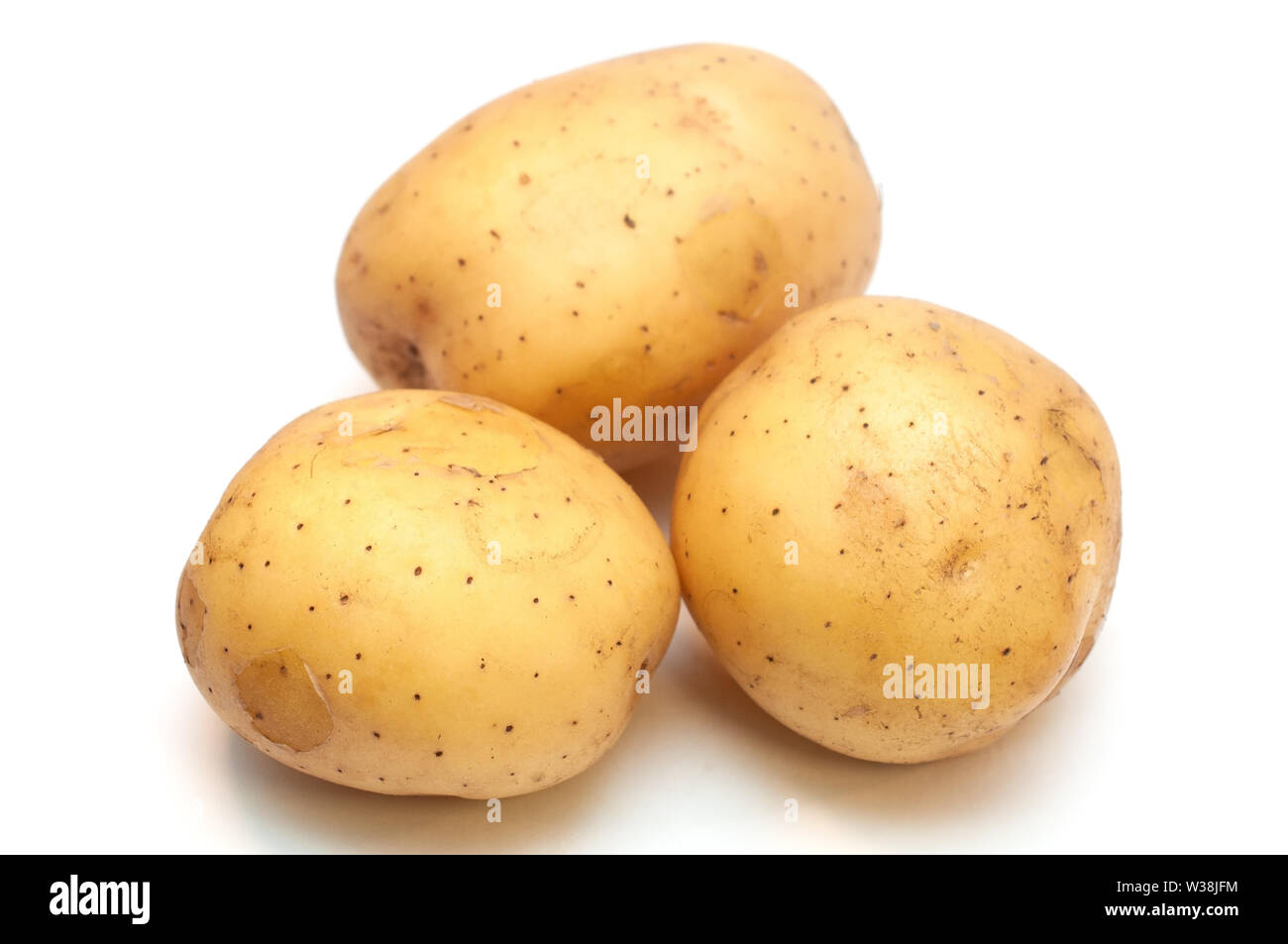 Raw potato group isolated on white Stock Photo - Alamy