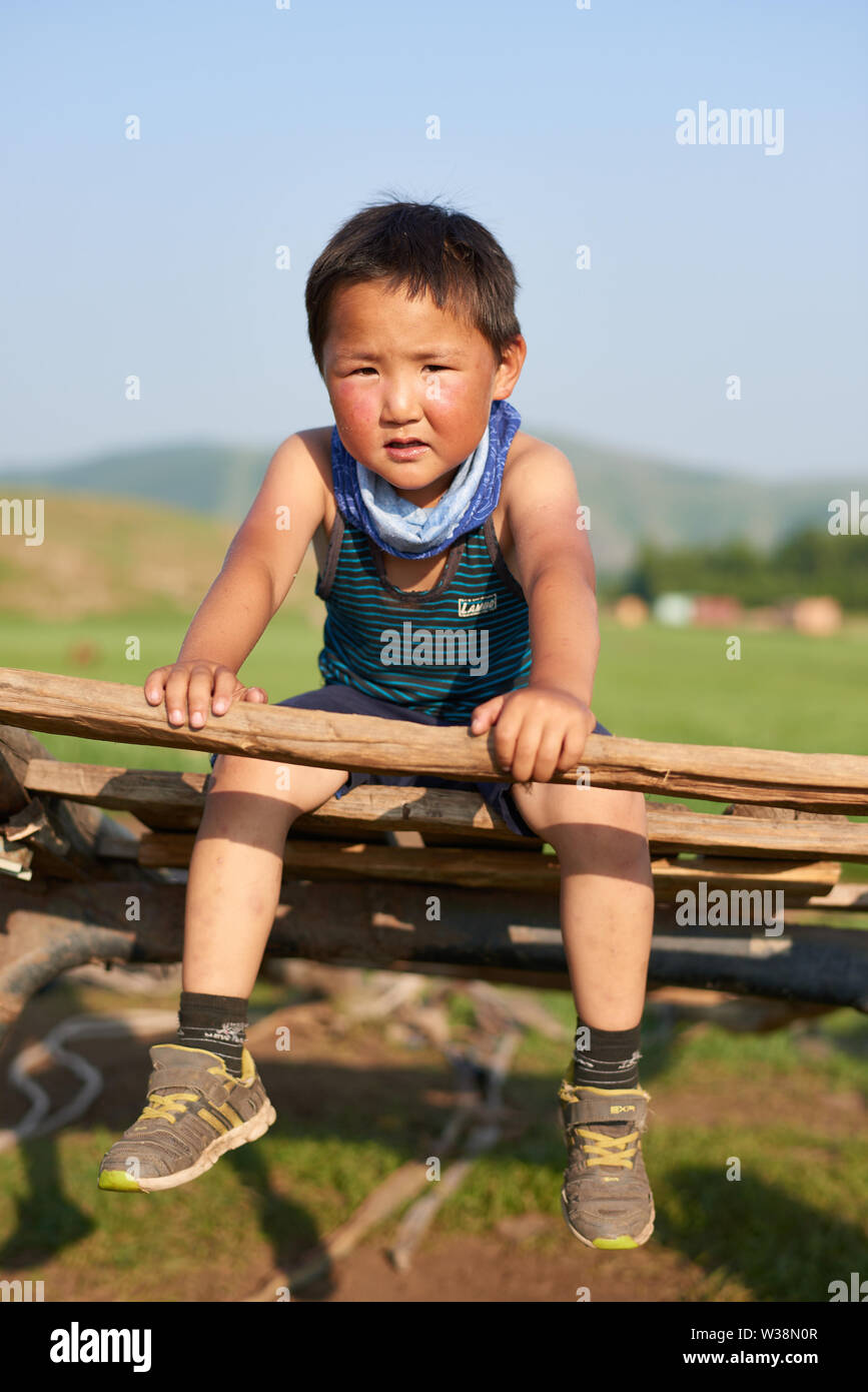 Boy on cart Stock Photo - Alamy