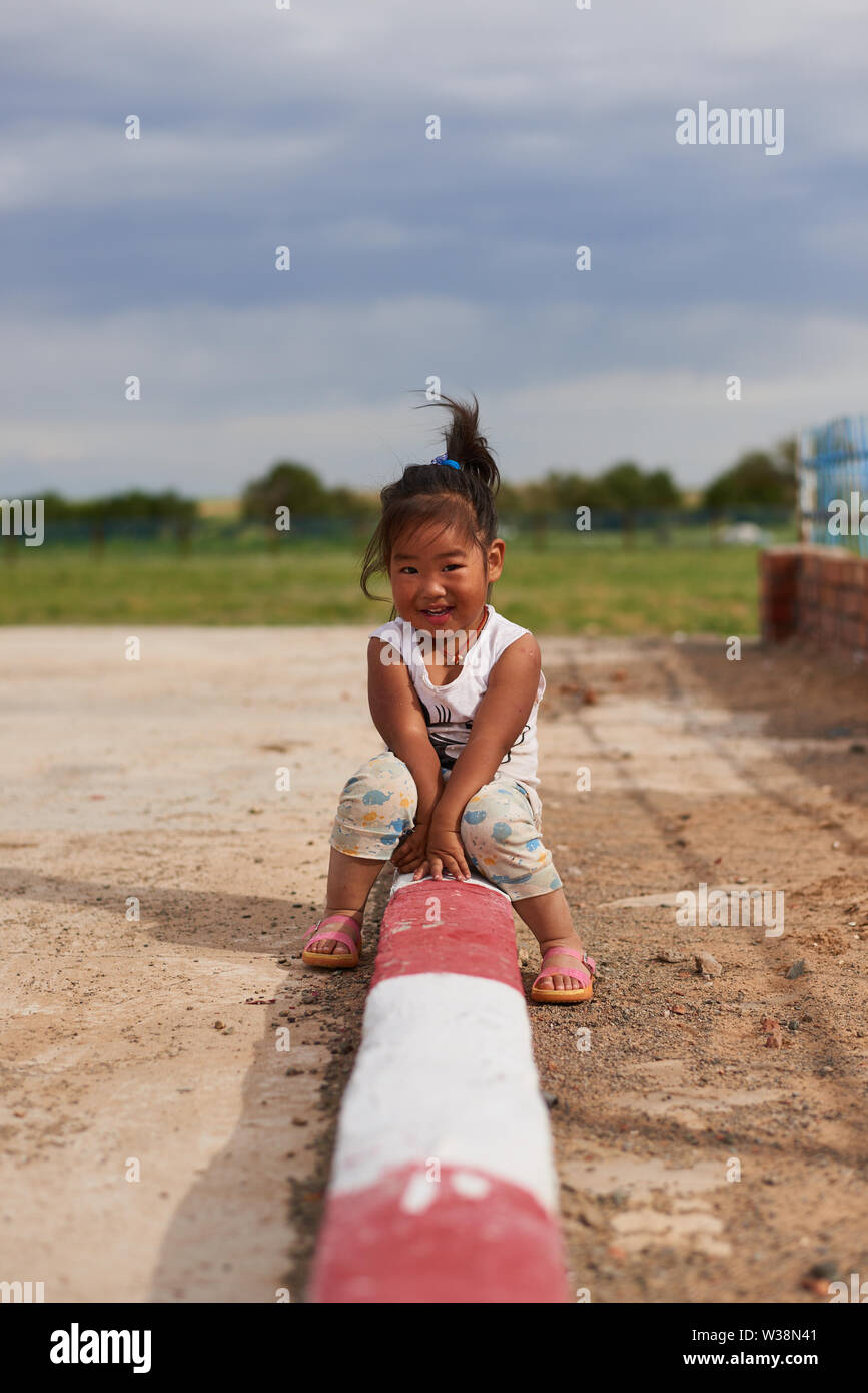 Girl by roadside Stock Photo - Alamy