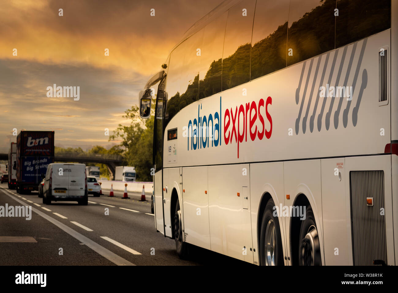 National Express Coach travelling down motorway Stock Photo - Alamy