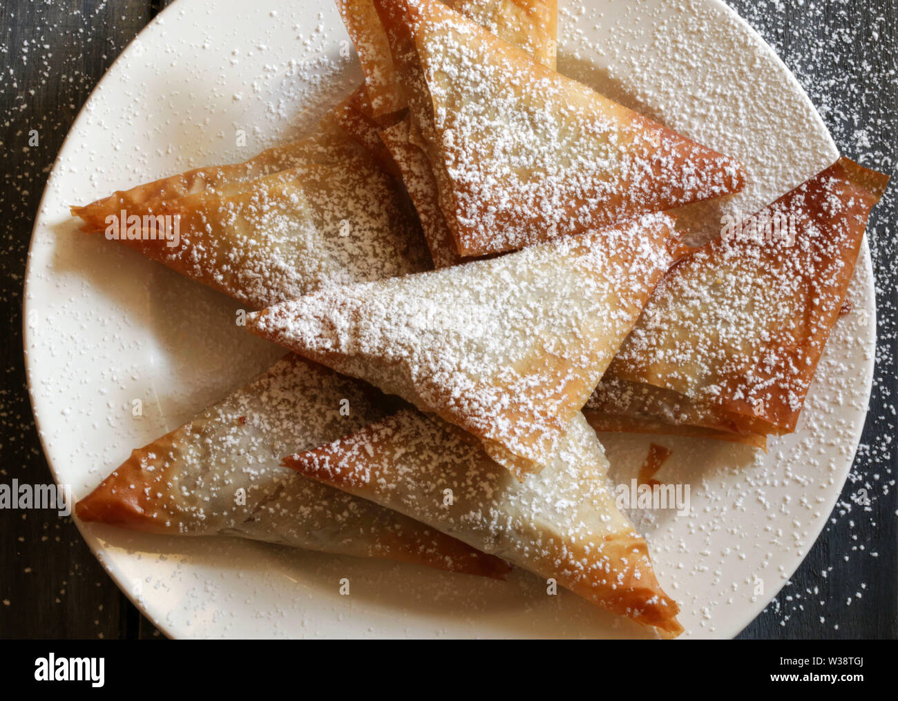 Traditional greek cuisine. Bougatsa, phyllo pastry filled with cream ...