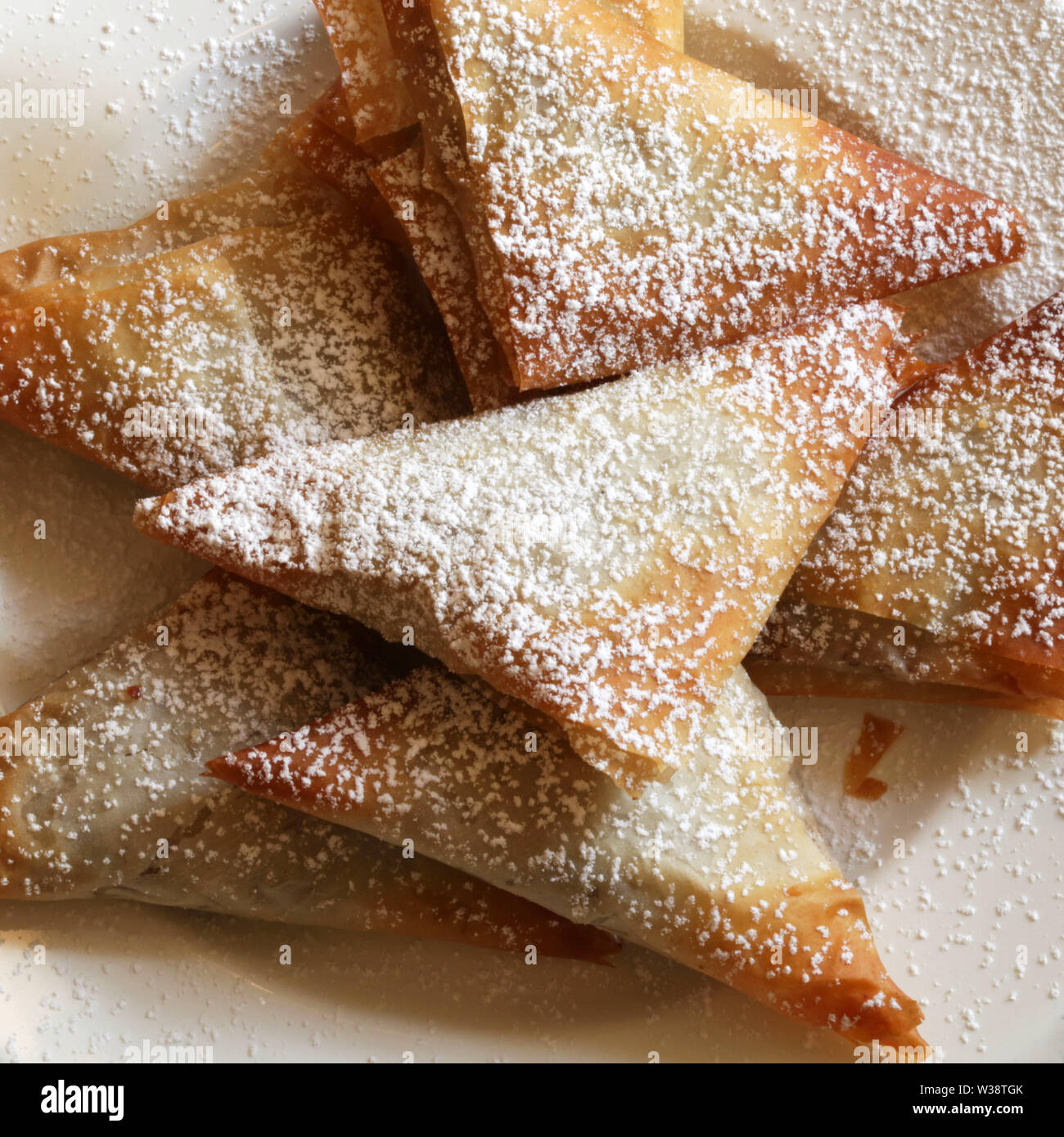 Traditional greek cuisine. Bougatsa, phyllo pastry filled with cream ...