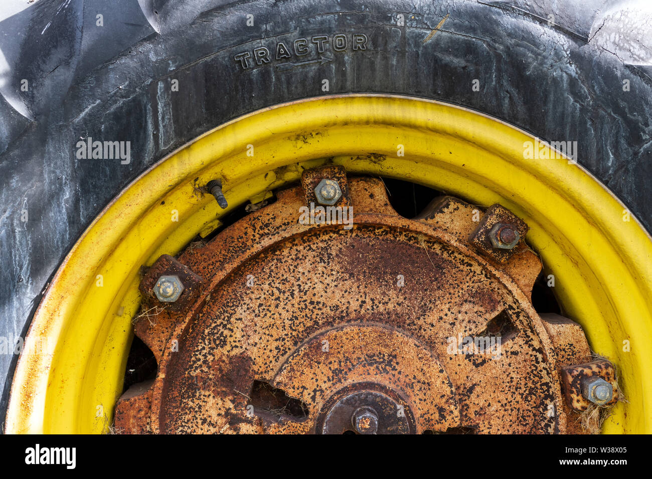 Rusty tractor rim and tire detail Stock Photo - Alamy