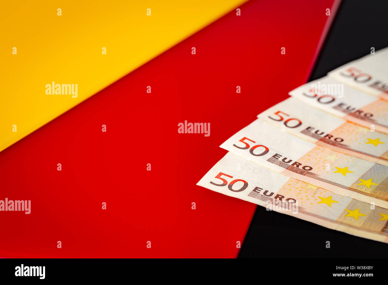 A German flag with euro banknotes Stock Photo - Alamy