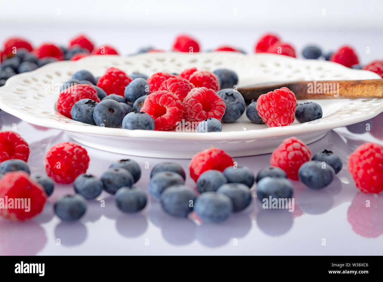Seasonal fruits, blueberry and raspberry Stock Photo - Alamy