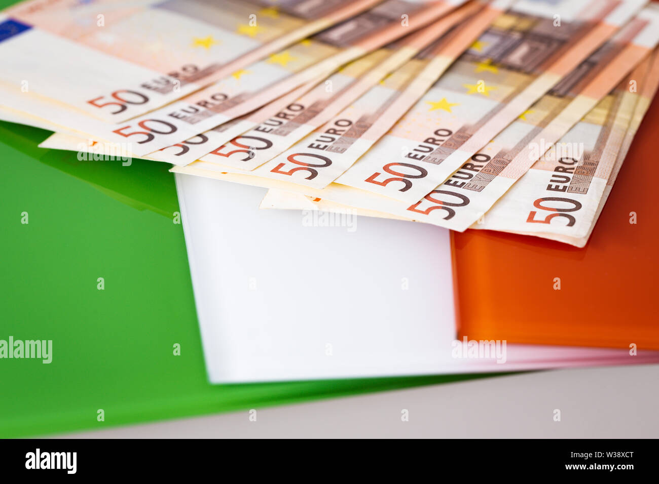 Irish flag with euro banknotes Stock Photo - Alamy