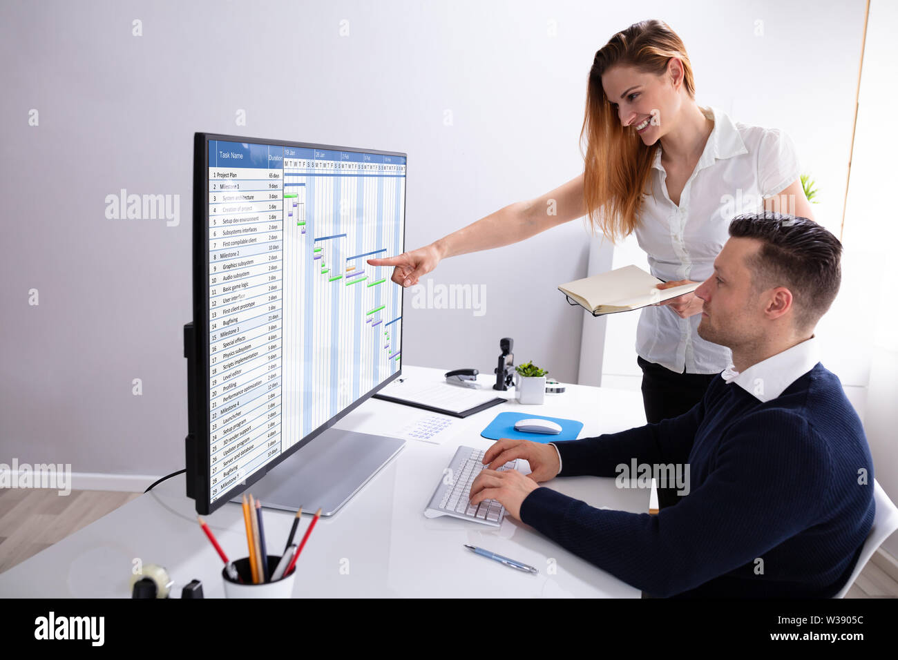 People pointing at monitor hi-res stock photography and images - Alamy