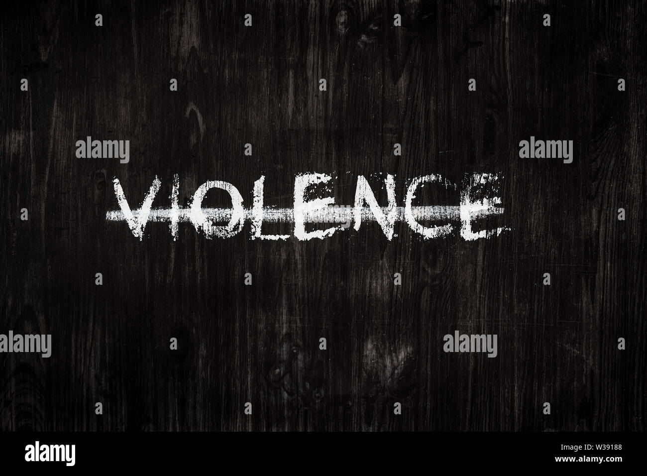 Violence word crossed out on black wood background. Sign, concept of ...