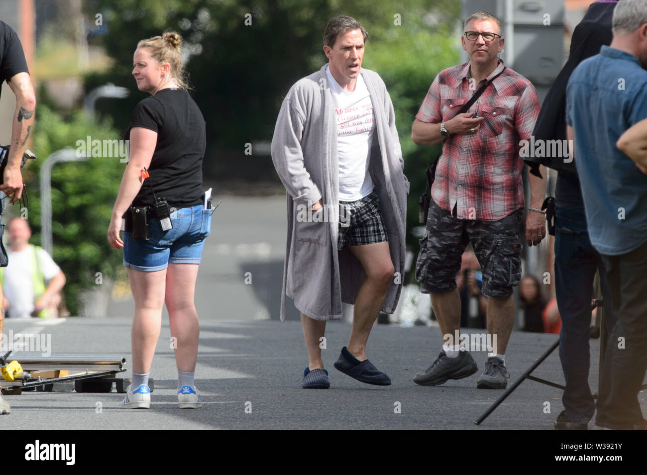 Barry, UK. 13th July, 2019. "Uncle Bryn" played by Rob Bryden films a ...