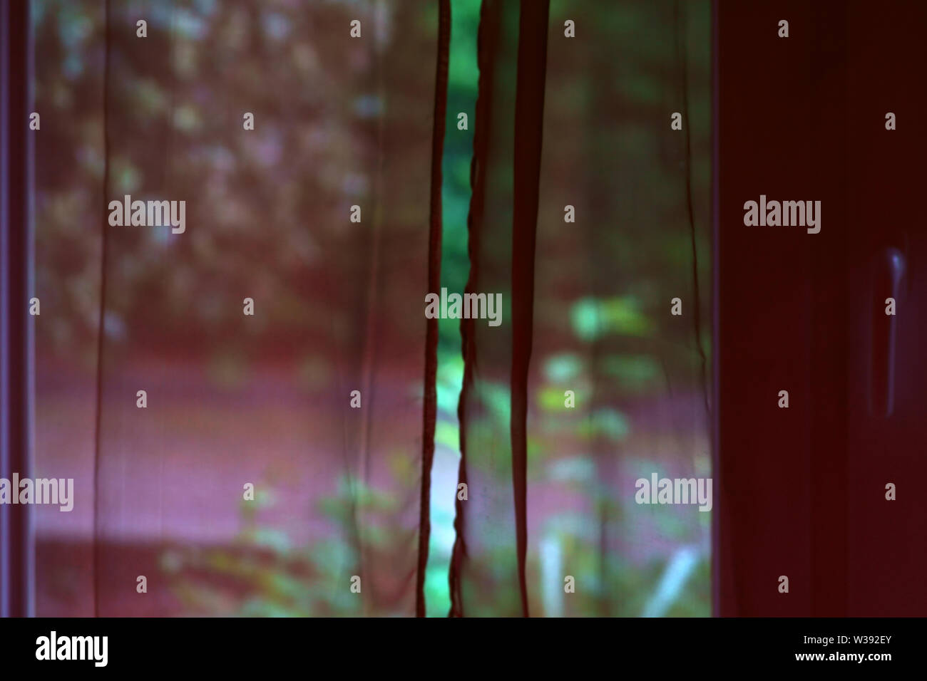 A dark room window in the evening with drawn curtains Stock Photo - Alamy