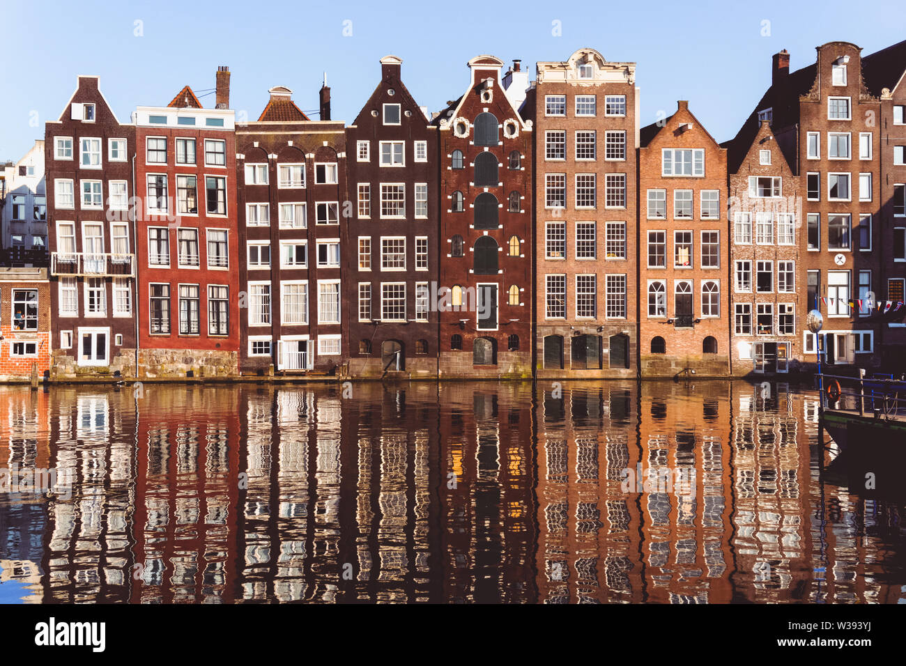 Traditional Dutch buildings at Damrak in Amsterdam, Netherlands Stock ...