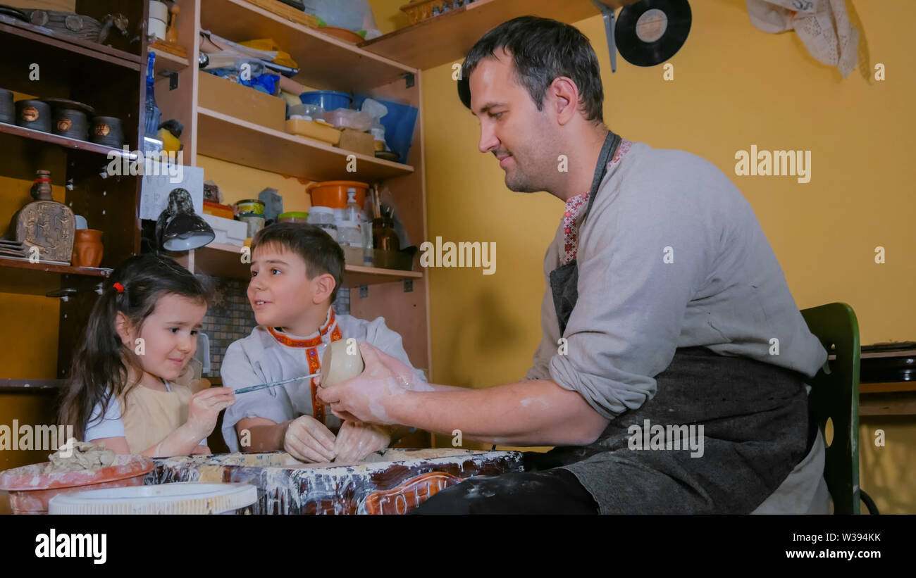 Family working with clay Stock Photo - Alamy