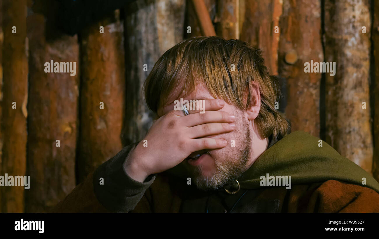 Portrait of sad man in russian ethnic suit Stock Photo - Alamy