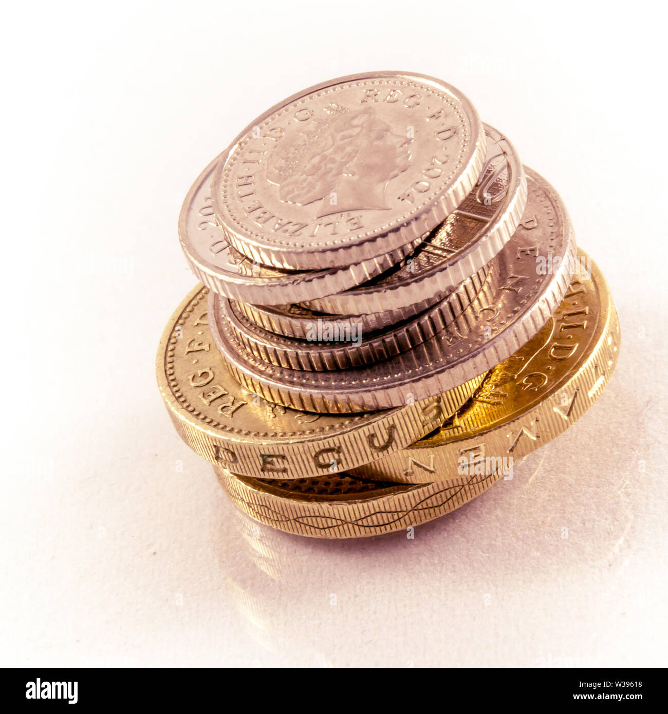 Coins isolated on white background, UK currency Stock Photo - Alamy