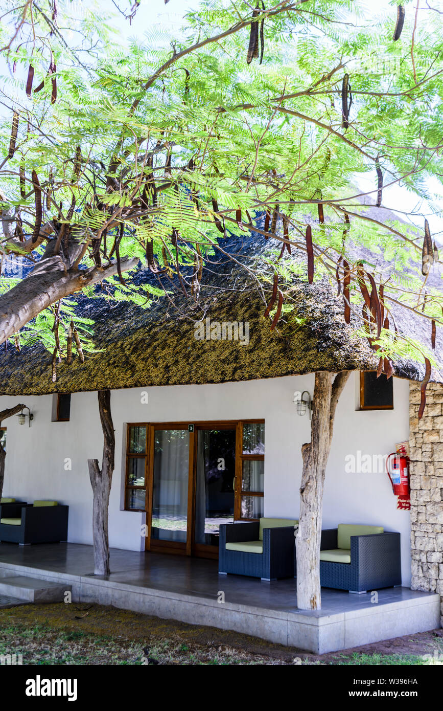 Thatched safari lodges in Namibia Stock Photo - Alamy