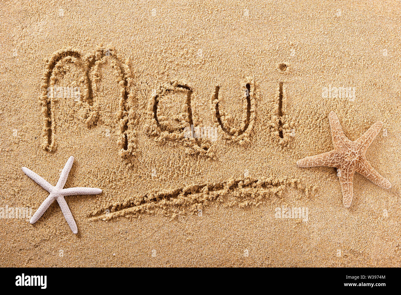 Maui Hawaii beach word travel writing concept Stock Photo - Alamy