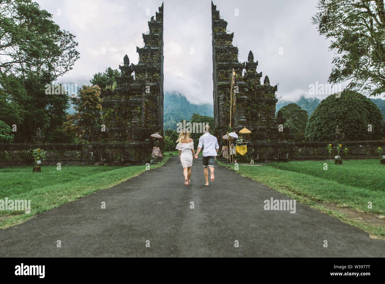 Couple of travelers at Handara Gate in Bali - Indonesia - Two tourists ...