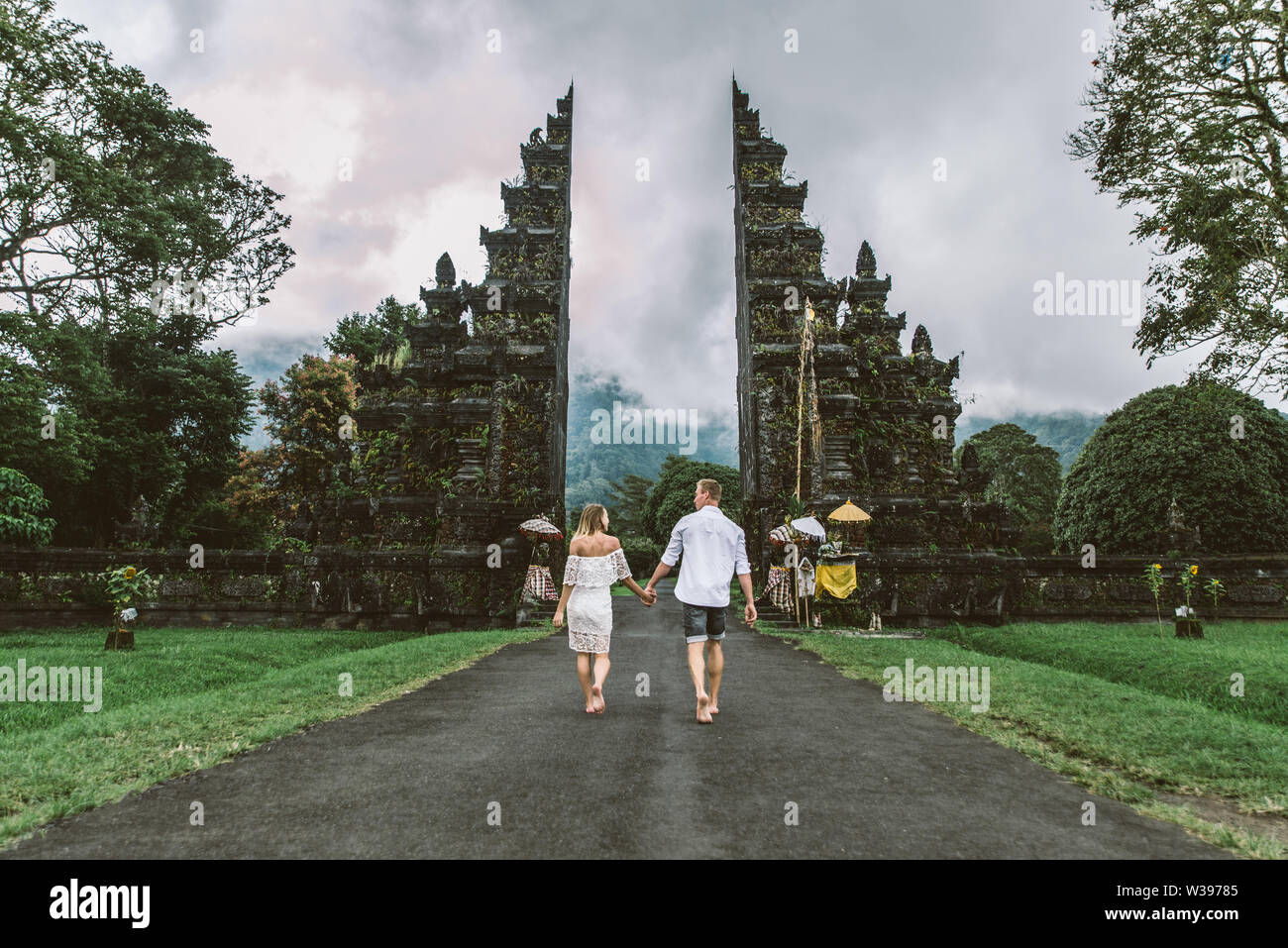 Couple of travelers at Handara Gate in Bali - Indonesia - Two tourists ...