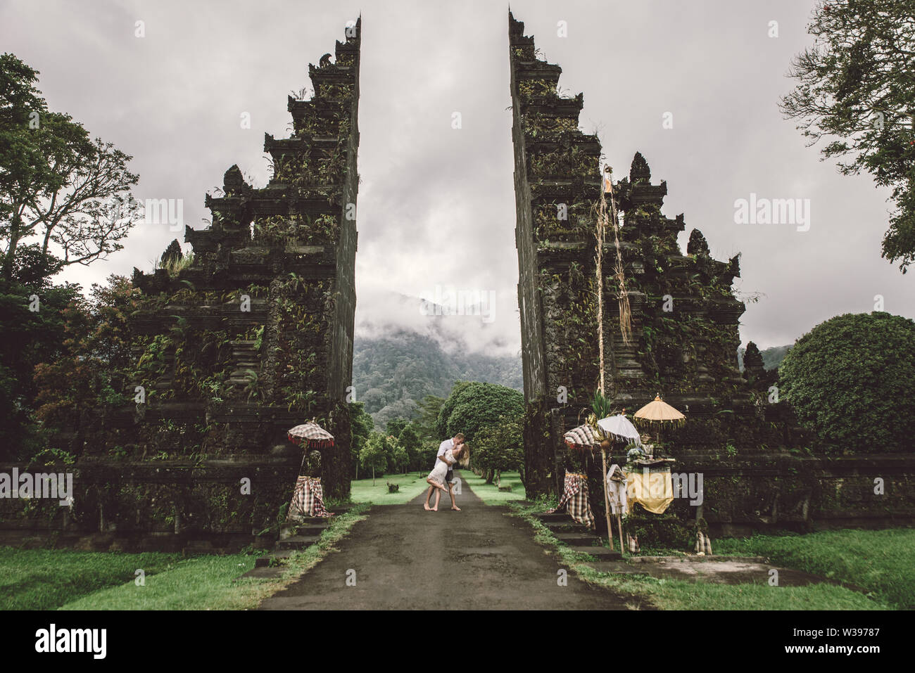 Couple of travelers at Handara Gate in Bali - Indonesia - Two tourists ...