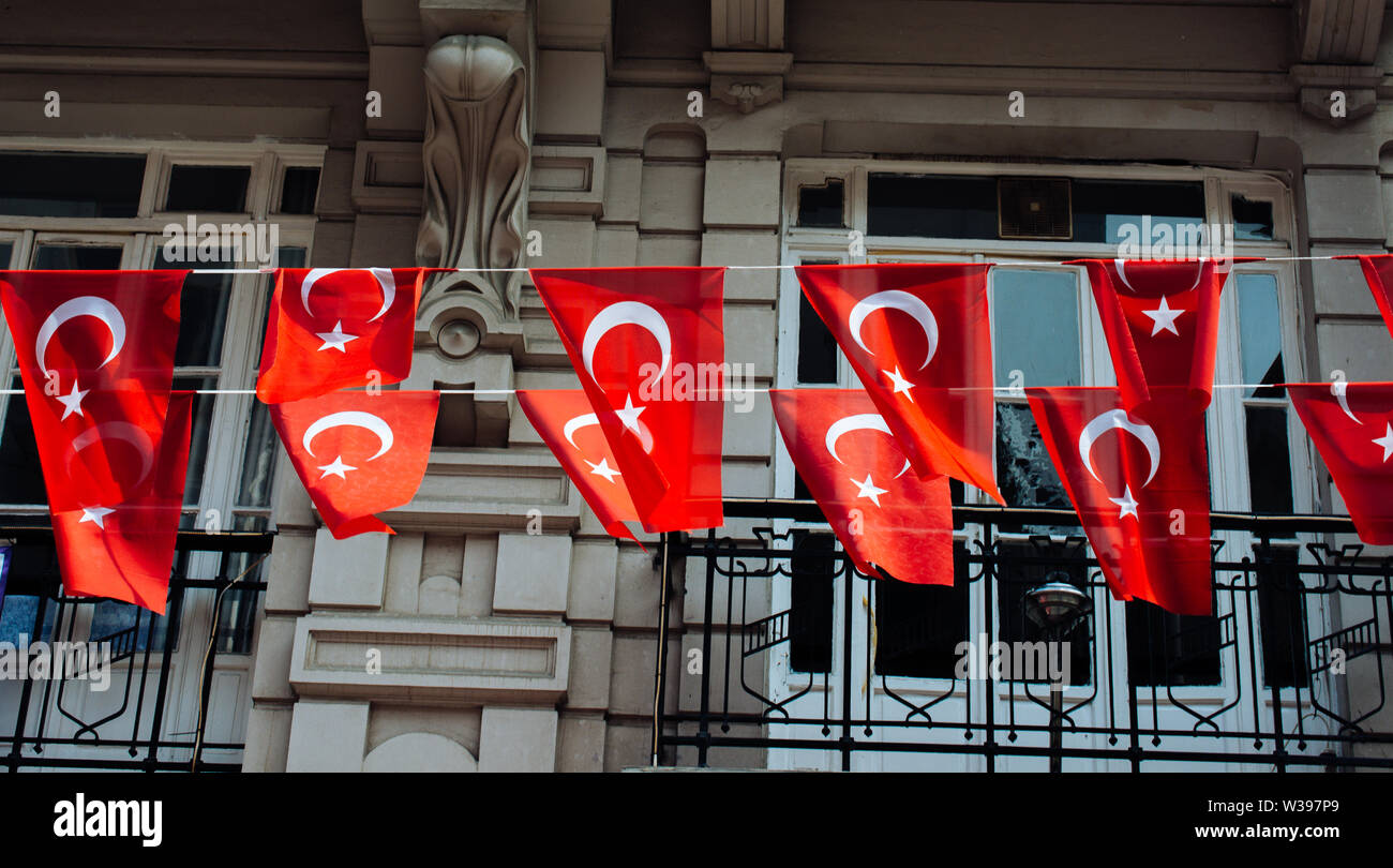 Turkish national flags with white star and moon in sky Stock Photo - Alamy