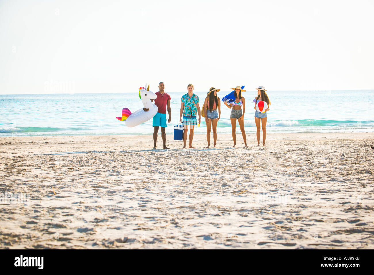 Group of friends having fun on the beach - Young and happy tourists ...