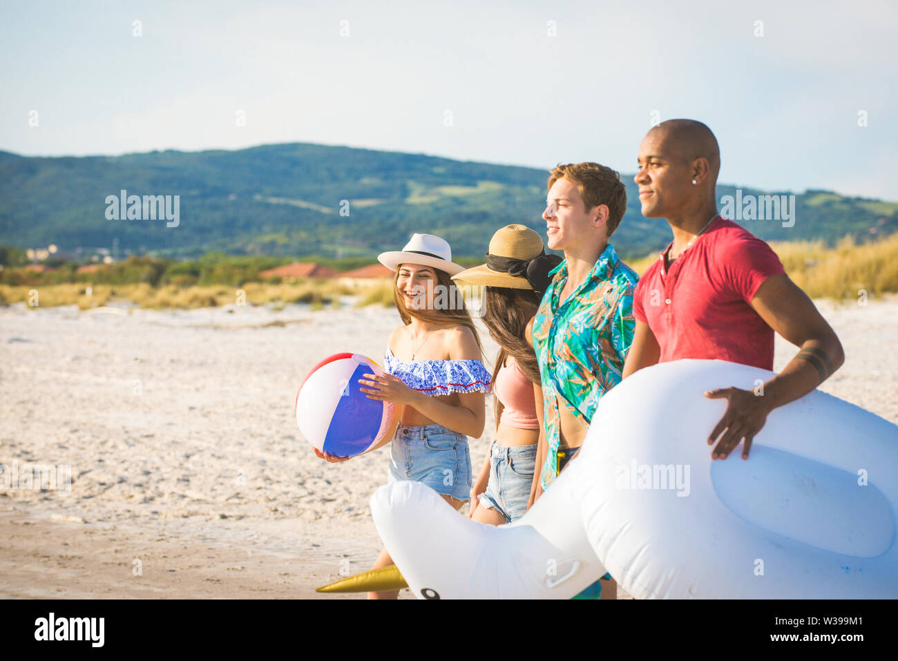Group of friends having fun on the beach - Young and happy tourists ...
