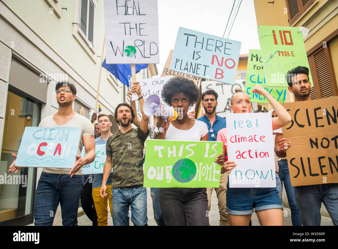 Group of activists is protesting outdoors - Crowd demonstrating against ...