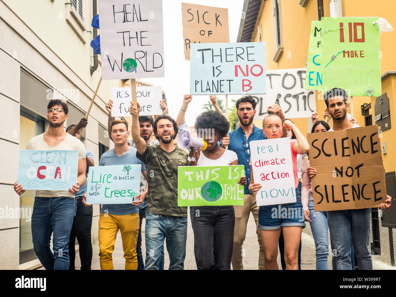 Group of activists is protesting outdoors - Crowd demonstrating against ...