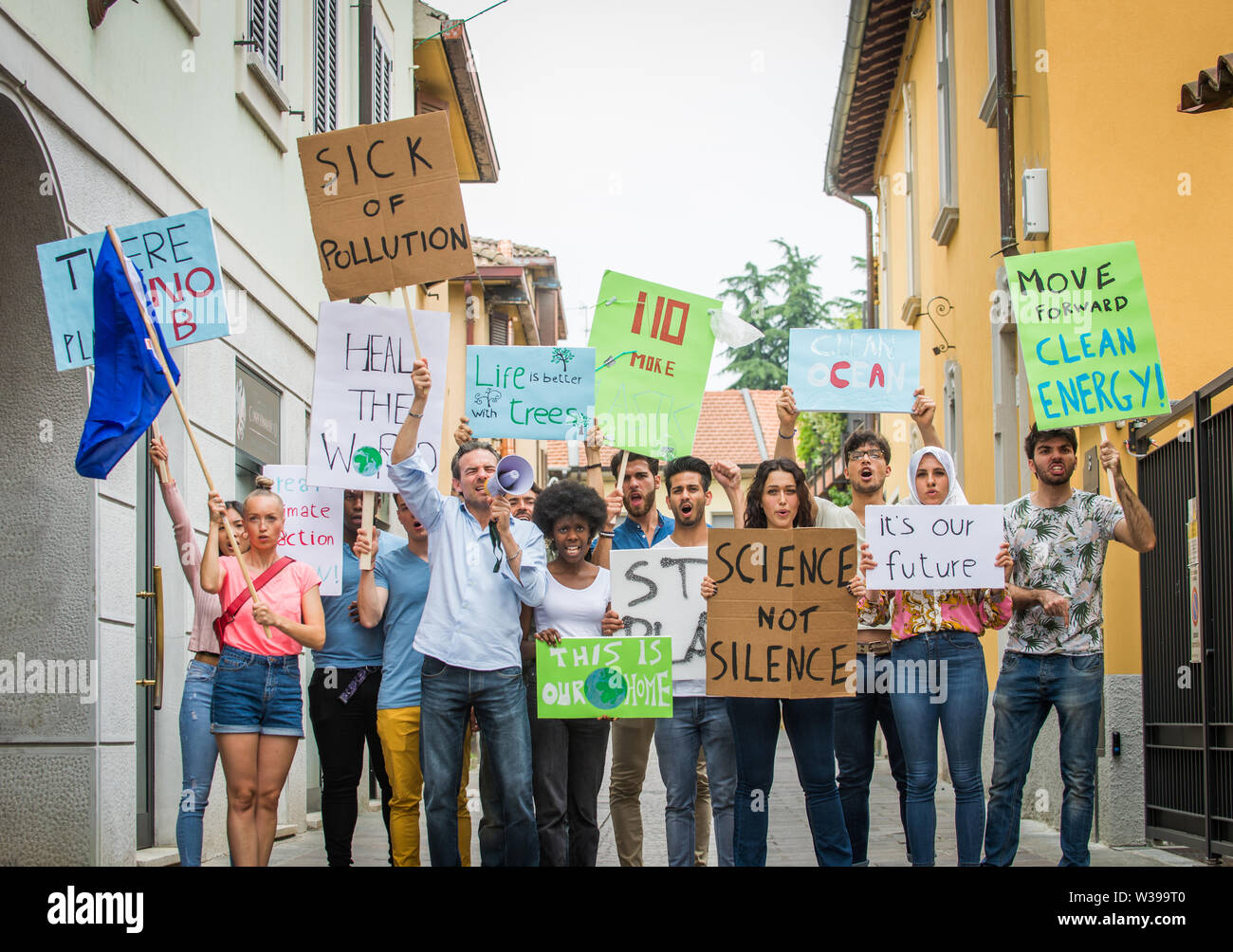 Group of activists is protesting outdoors - Crowd demonstrating against ...