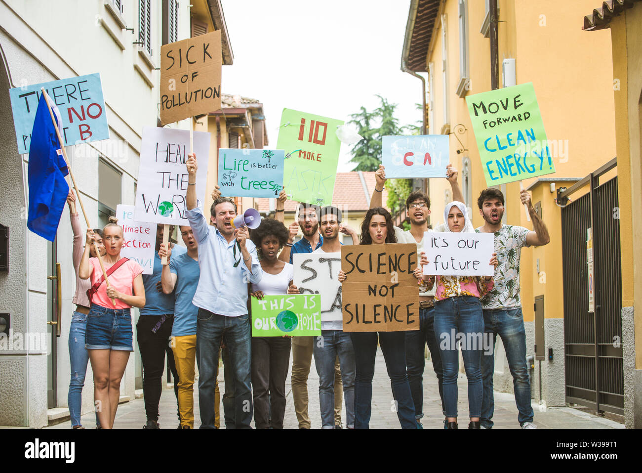 Group of activists is protesting outdoors - Crowd demonstrating against ...