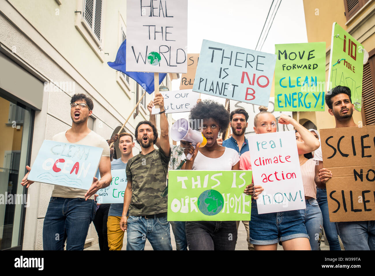 Group of activists is protesting outdoors - Crowd demonstrating against ...