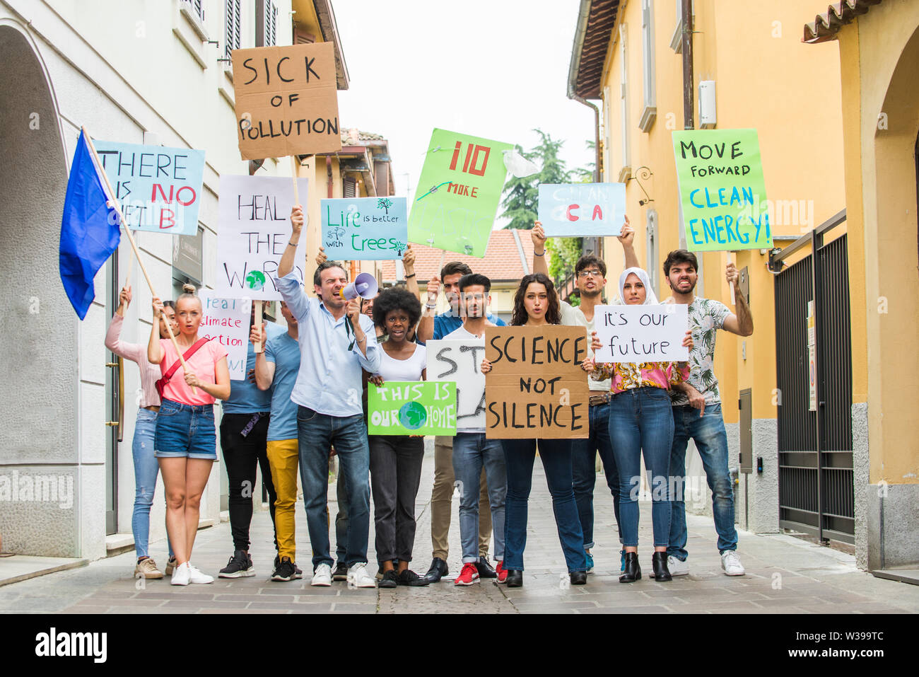 Group of activists is protesting outdoors - Crowd demonstrating against ...