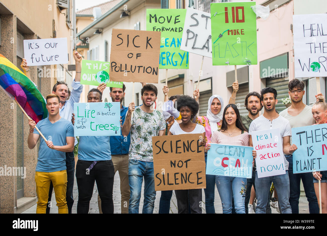 Group of activists is protesting outdoors - Crowd demonstrating against ...
