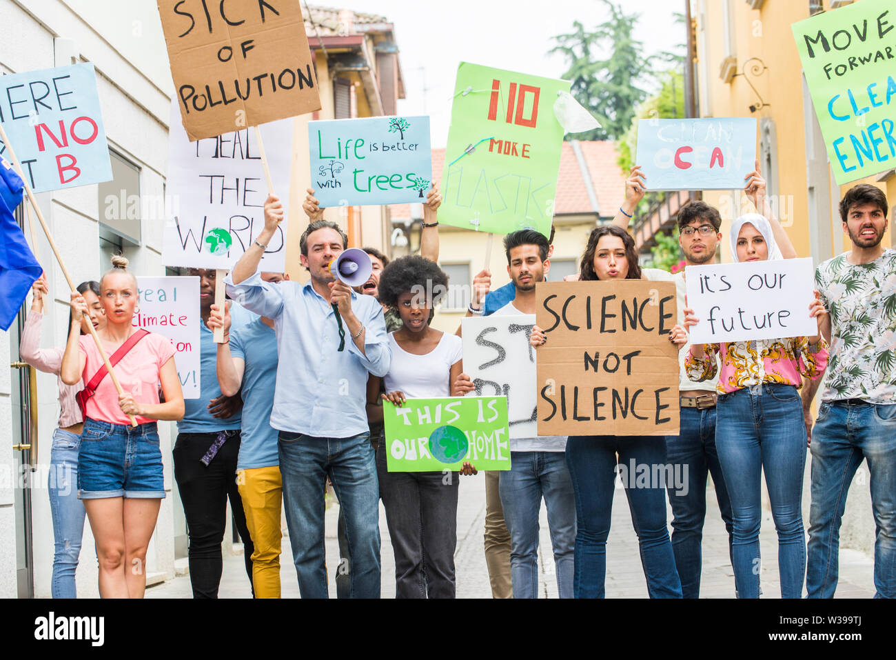 Group of activists is protesting outdoors - Crowd demonstrating against ...