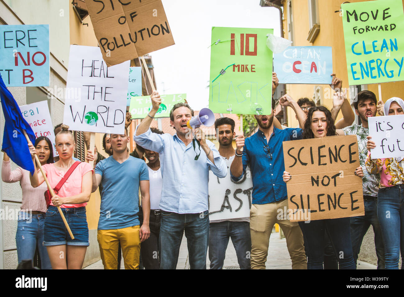 Group of activists is protesting outdoors - Crowd demonstrating against ...