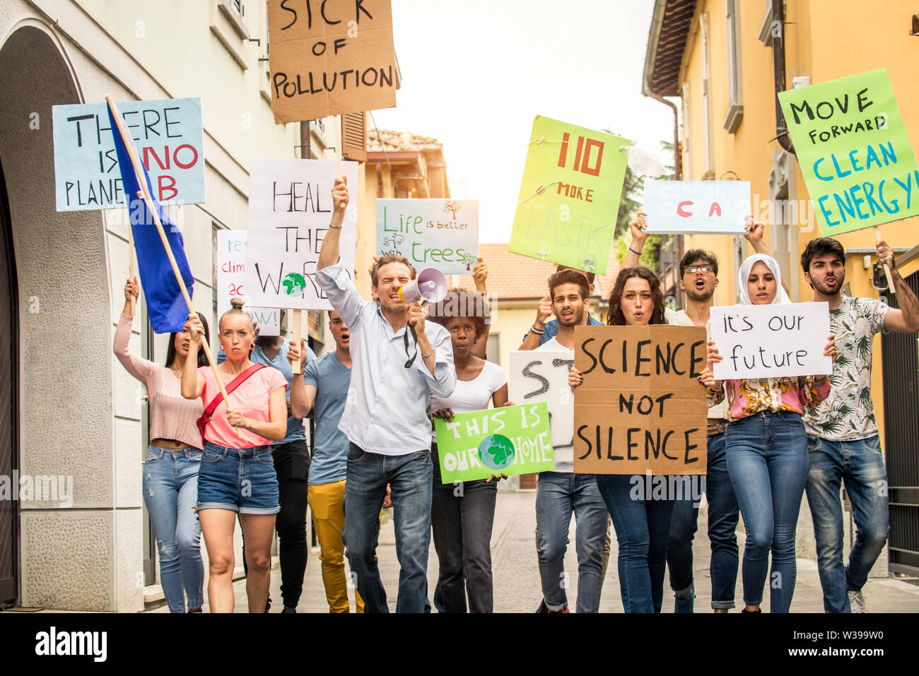 Group of activists is protesting outdoors - Crowd demonstrating against ...